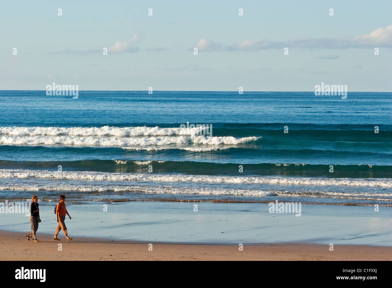 People strolling on Lanzarote's finest surf beach at Famara in the ...