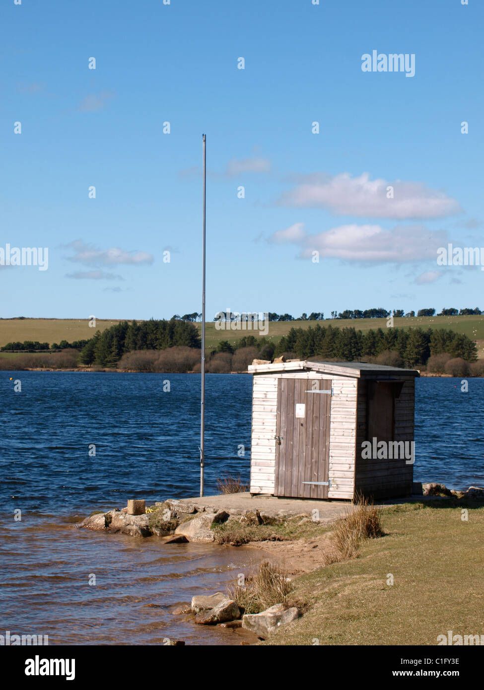 Wooden shed beside a lake, UK Stock Photo - Alamy
