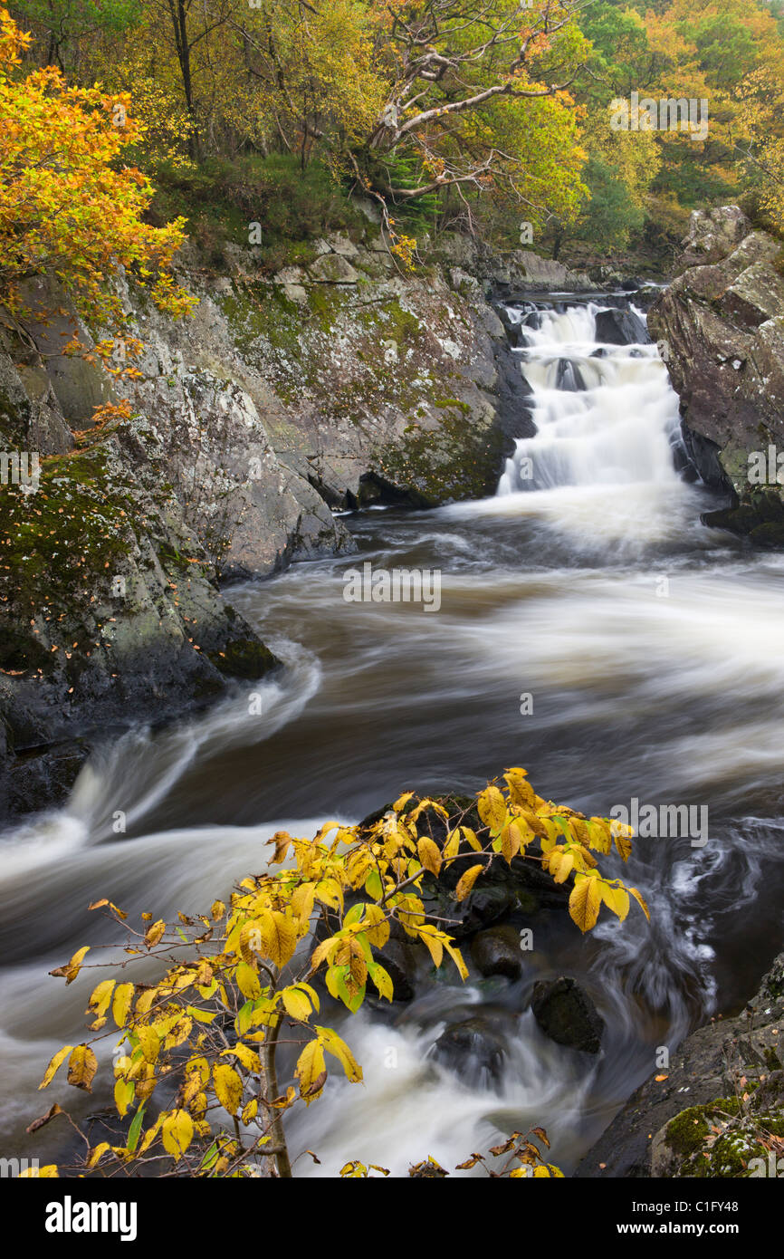 Garbe Uisge river and the Falls of Leny surrounded by autumn foliage ...