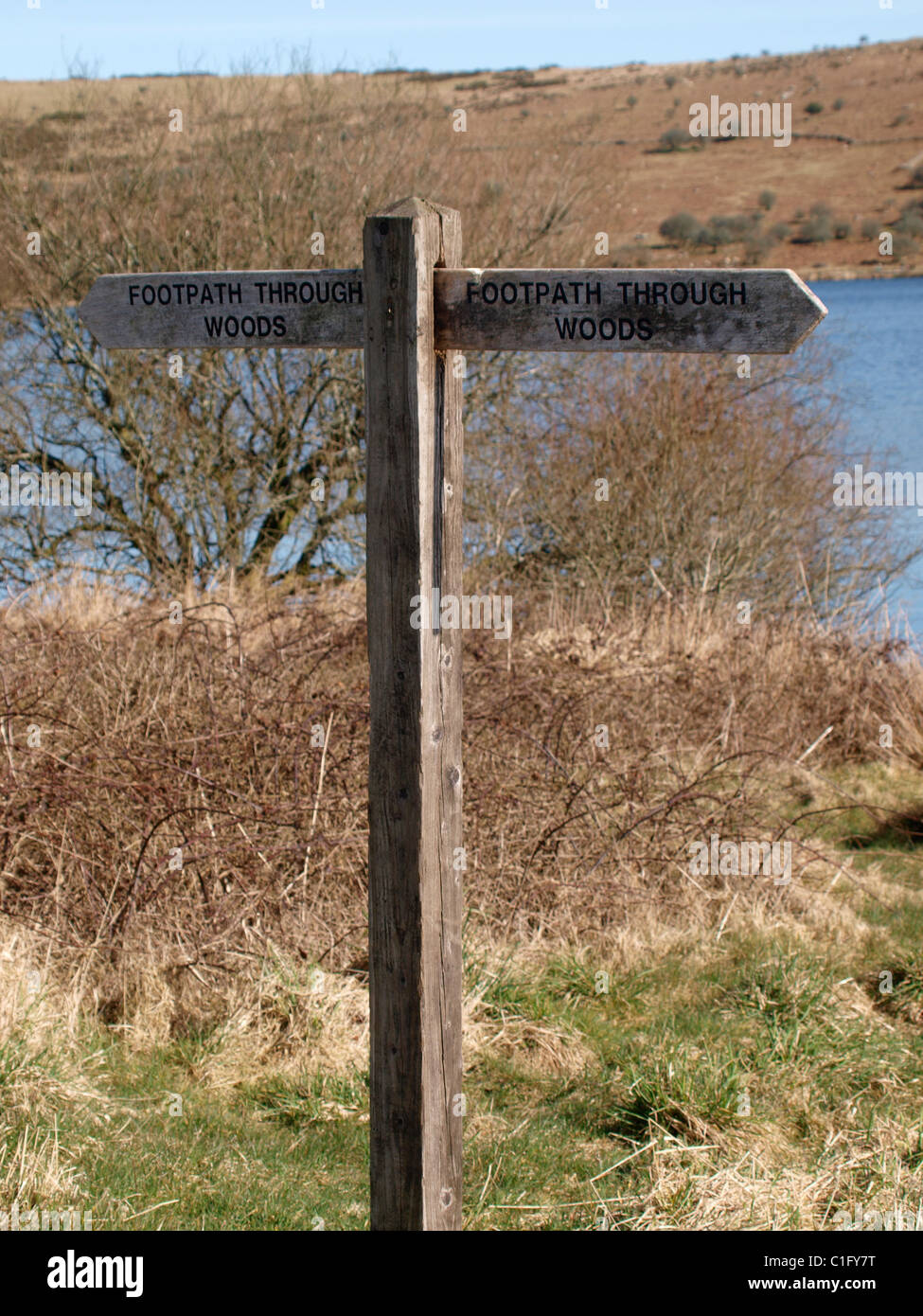 Footpath through woods sign post, UK Stock Photo - Alamy
