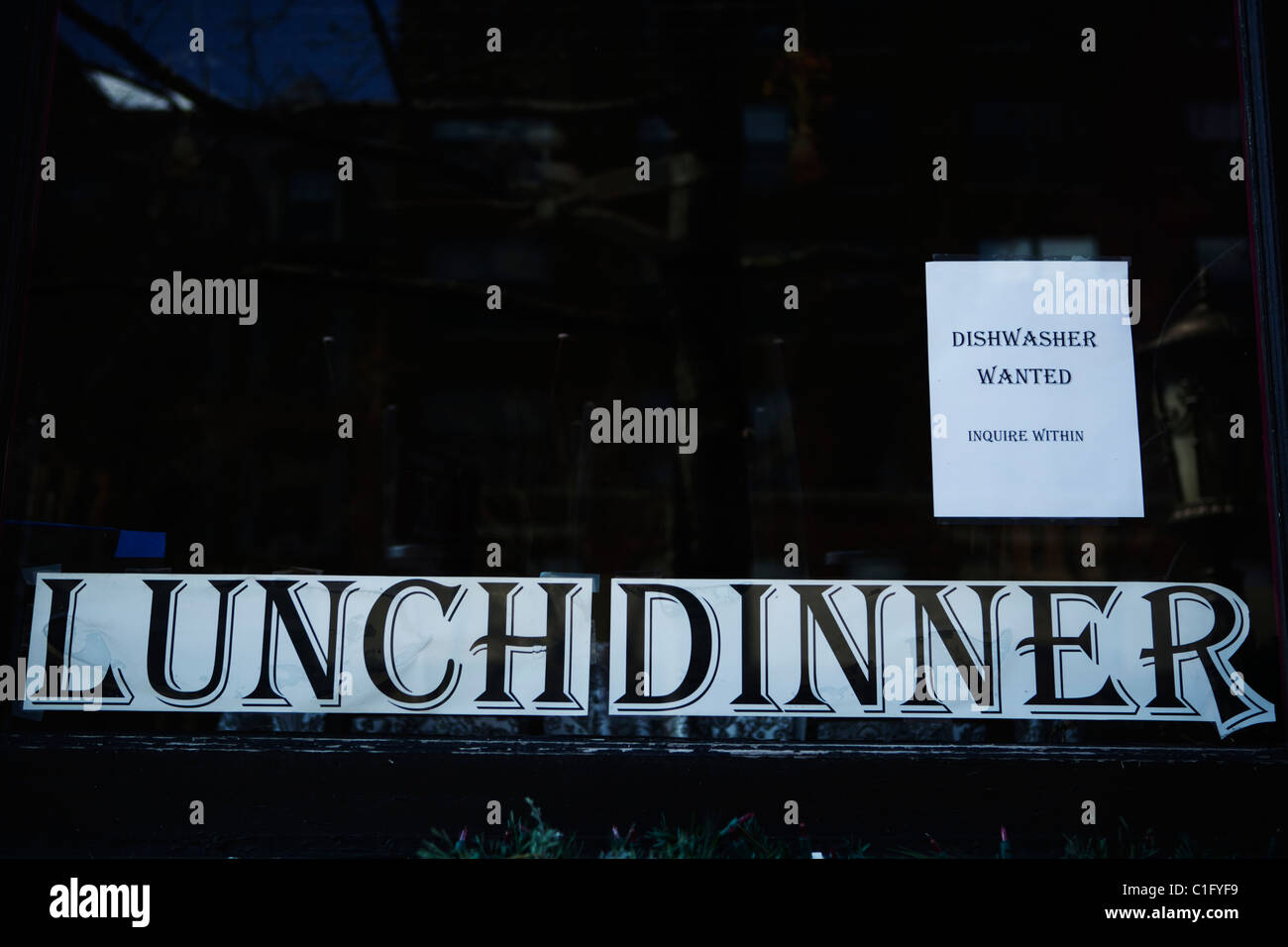 Lunch Dinner signs in a window in the West Village New York with a sign ...