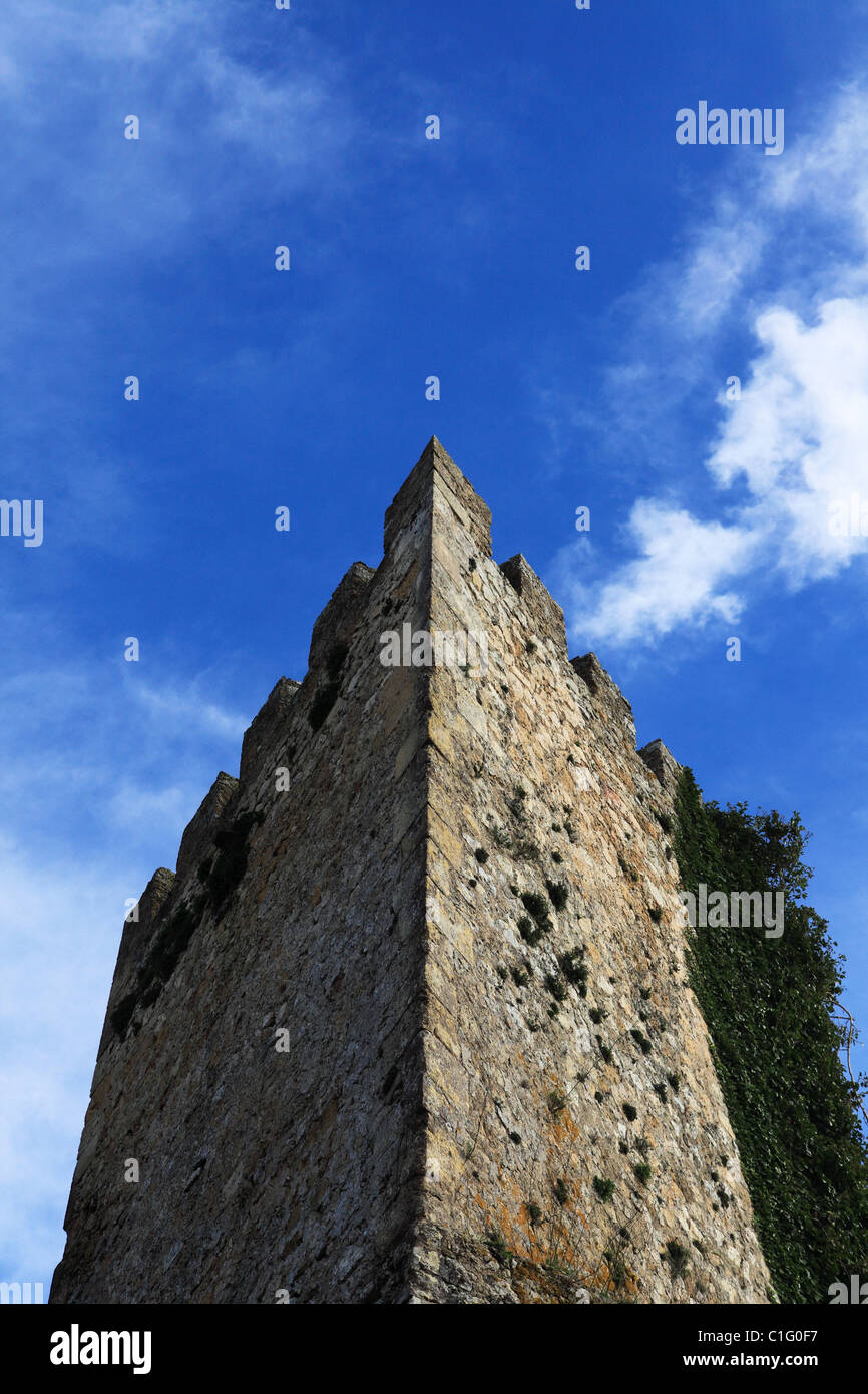 The tower of a medieval castle stands out against a blue sky Stock ...