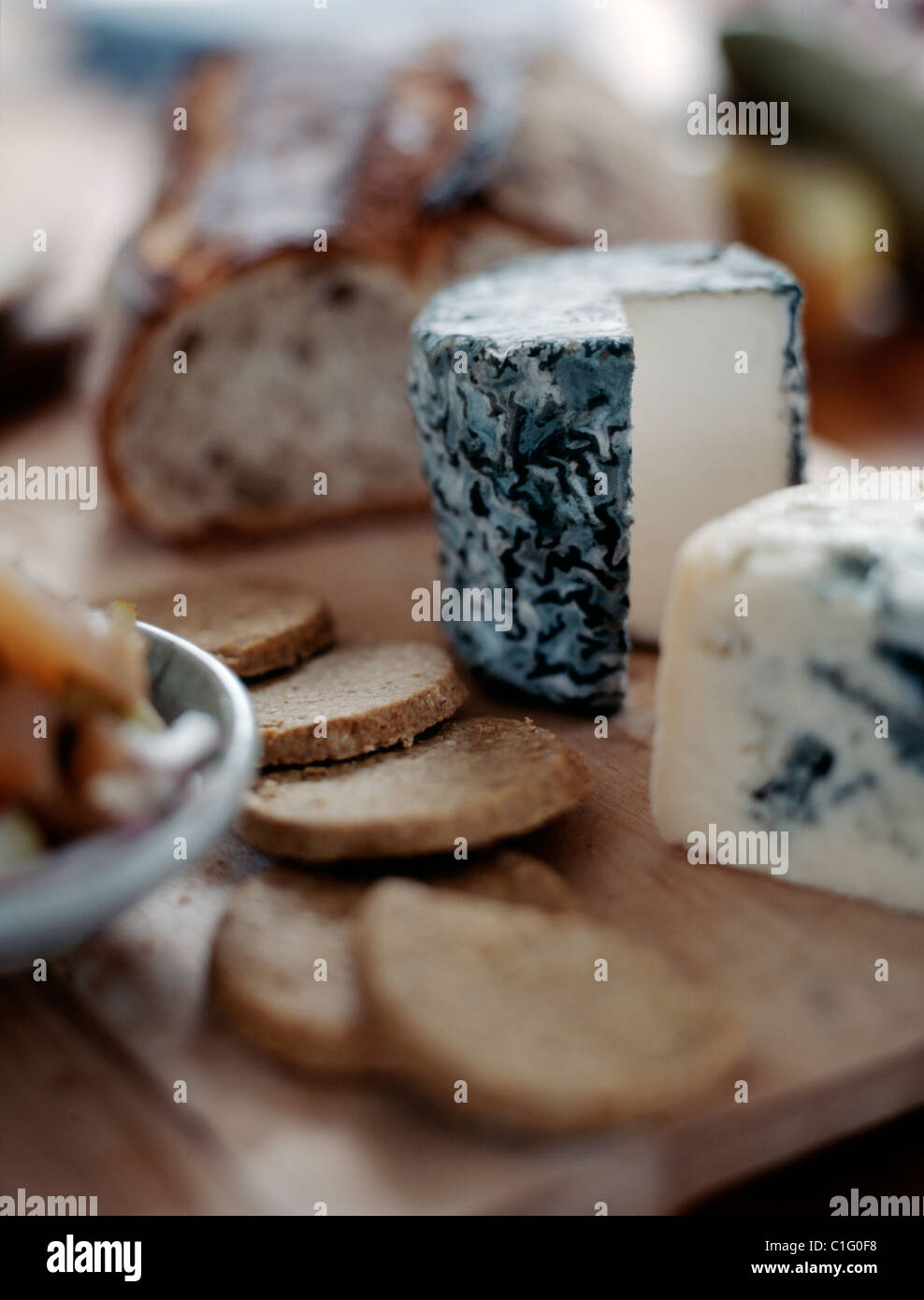 Cheese board detail with cheese, biscuits, bread and chutney Stock ...
