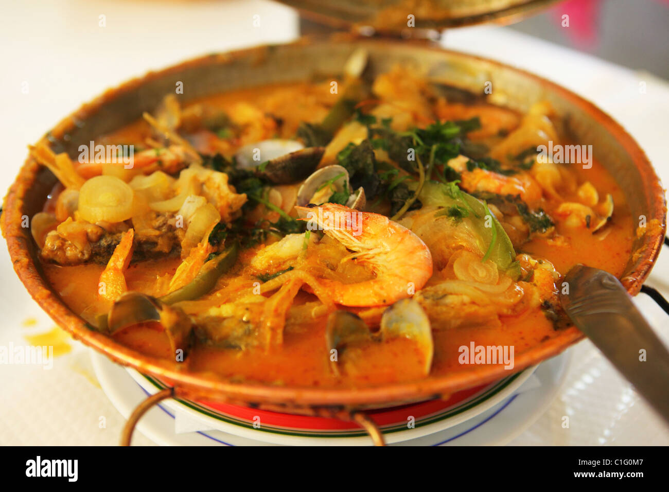 A typical Portuguese Cataplana do Morisco is served for lunch Stock ...