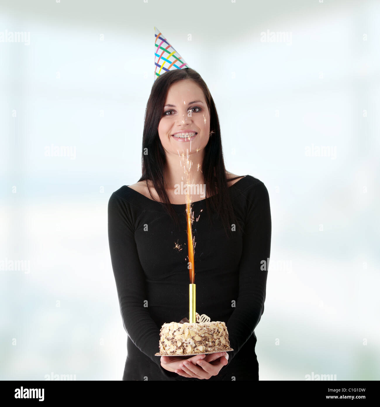 Beautiful young woman with birthday cake Stock Photo - Alamy