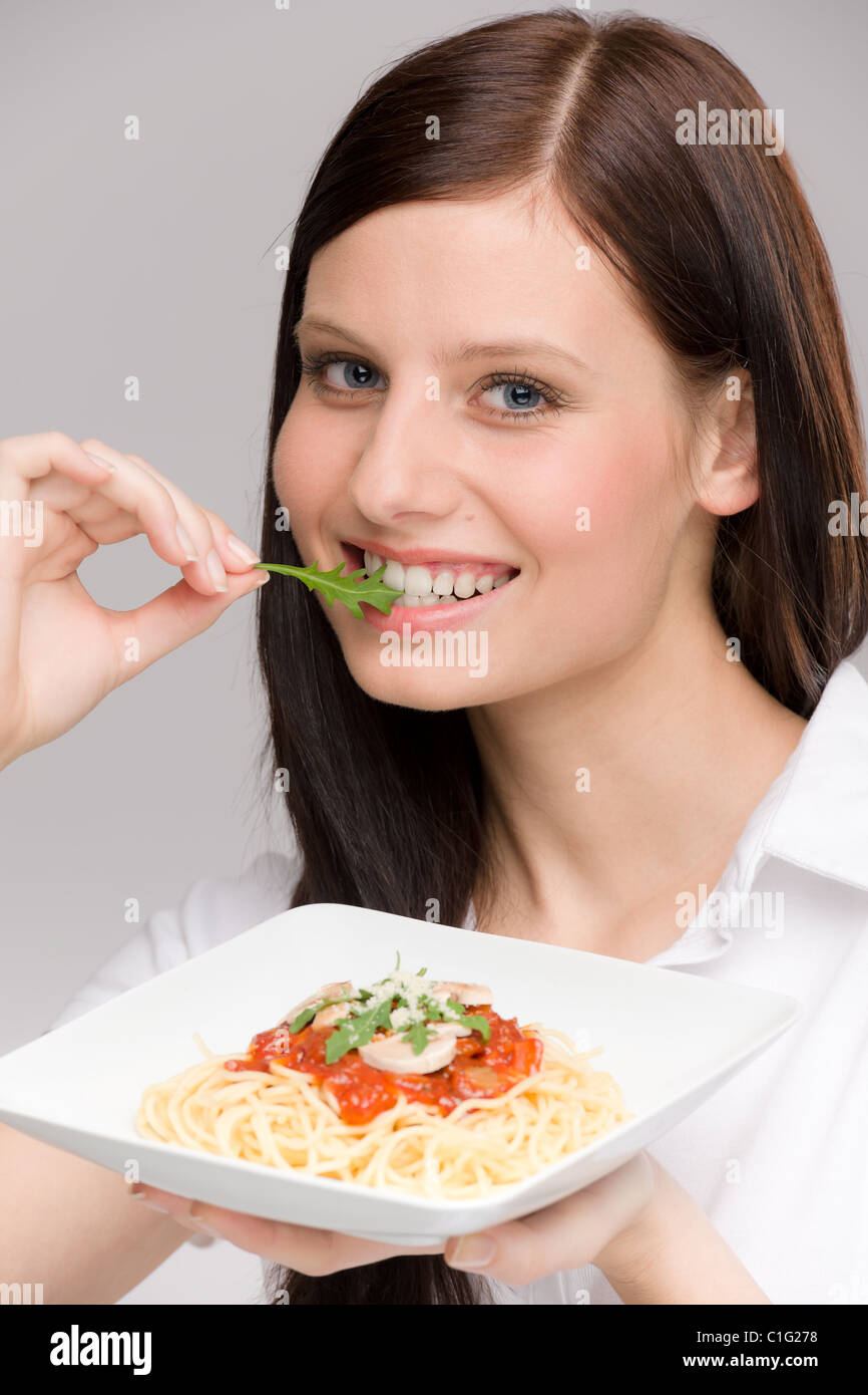 Italian food - portrait of healthy woman eat spaghetti with sauce Stock ...