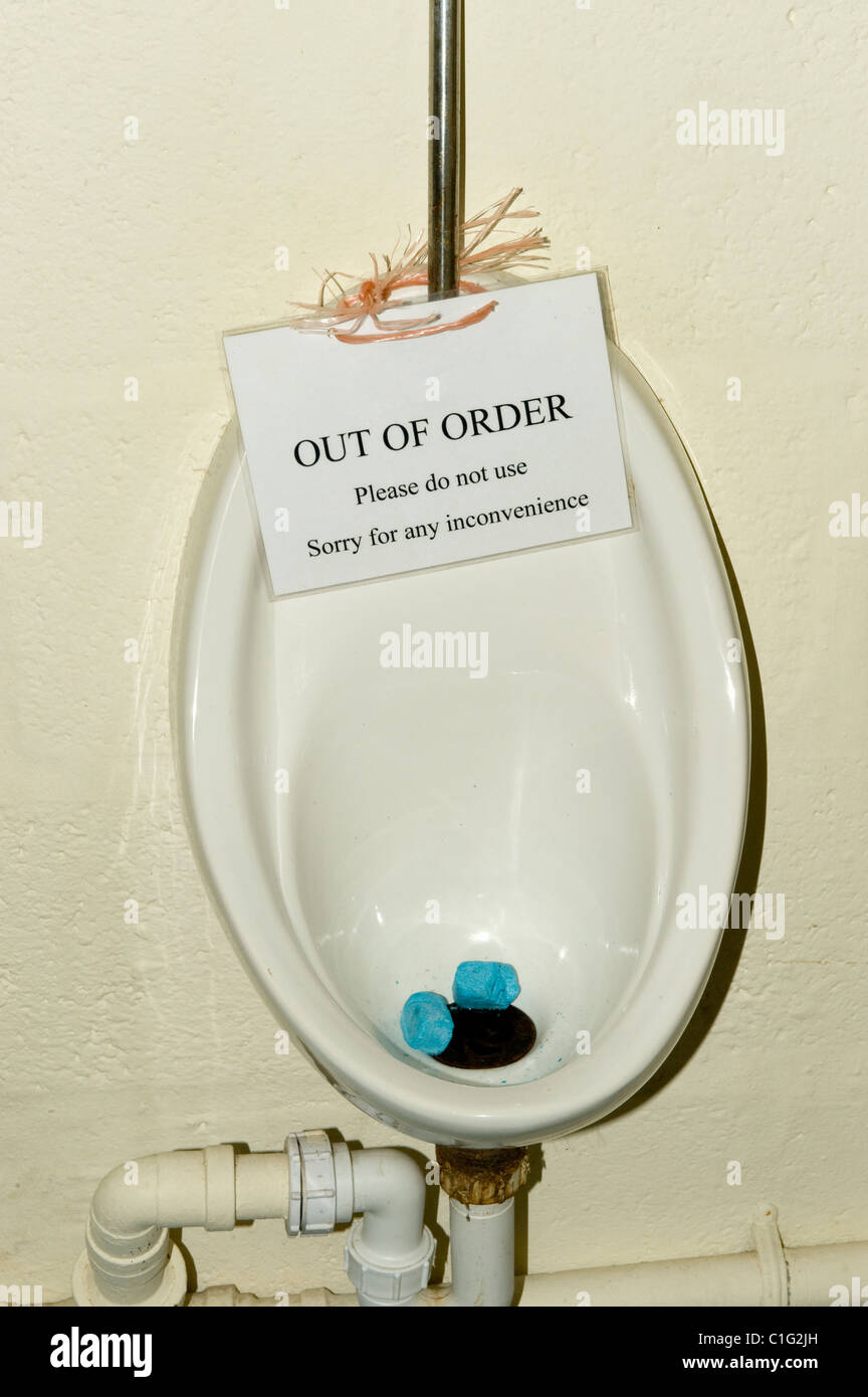 Urinal with out of order inconvenience notice Stock Photo - Alamy
