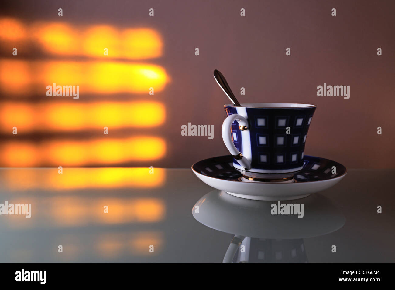 cup on a glass table Stock Photo - Alamy