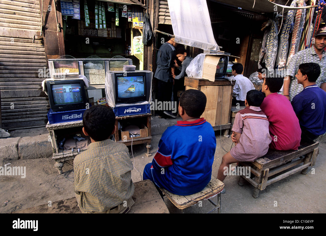 Egypt, Cairo, video-games played in a street of the old Muslim city ...