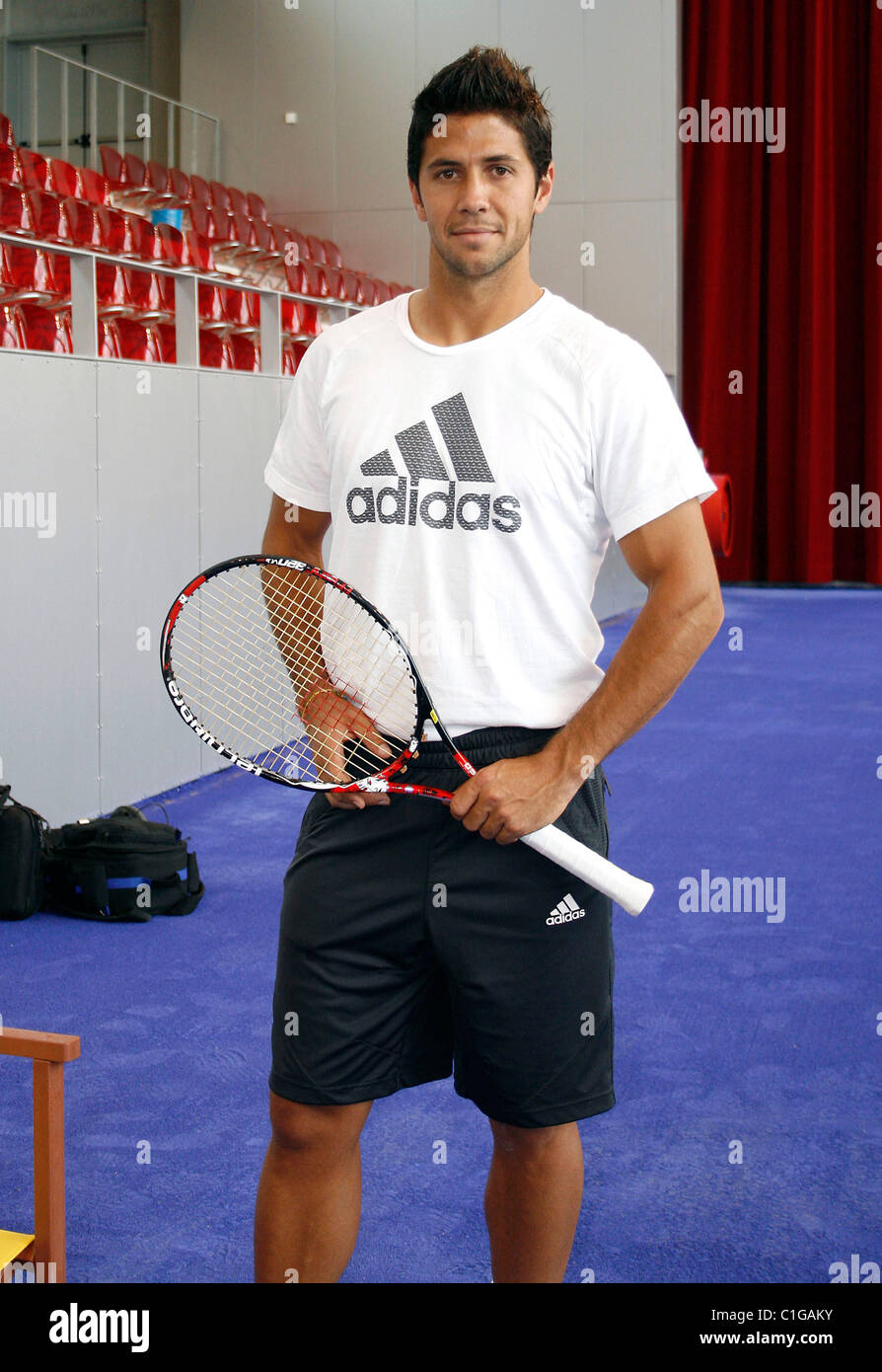 Fernando Verdasco poses for photos as he is interviewed by the press ...