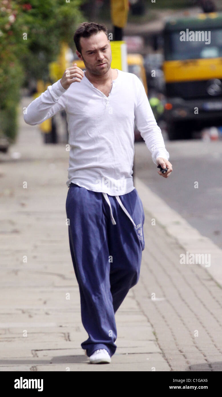 DJ Tom Crane emerges from his house to remove a parking ticket from his ...