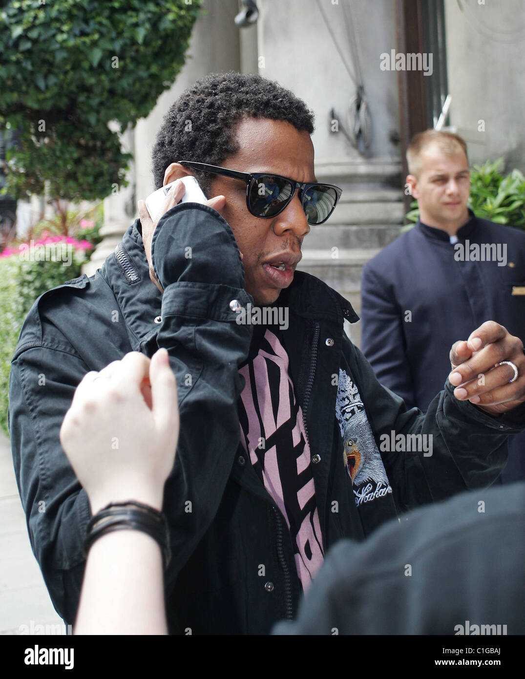 Jay-Z talks on his mobile phone when leaving Harvey Nichols London ...