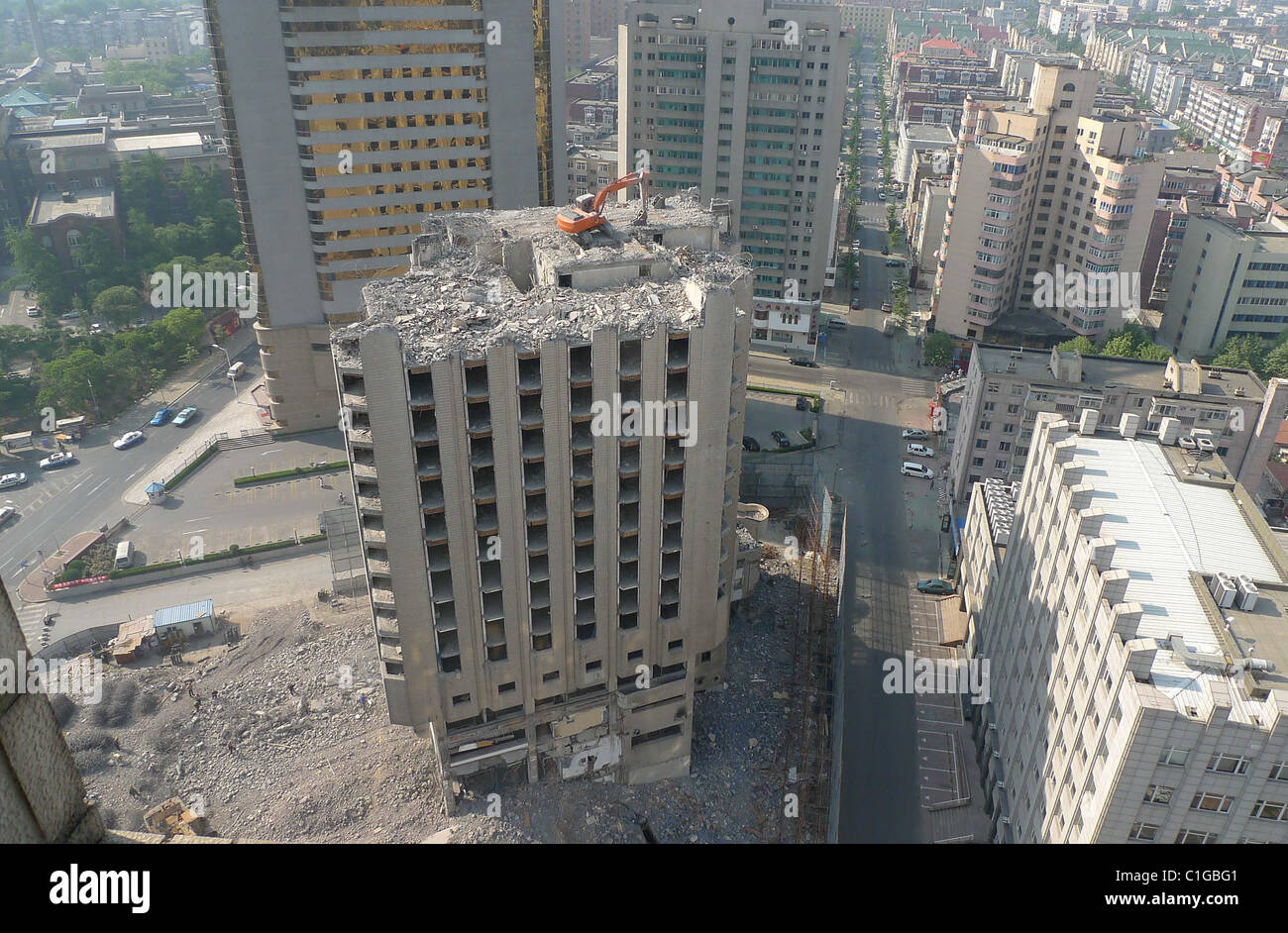 Chinese demolition workers use an unconventional method to destroy a ...