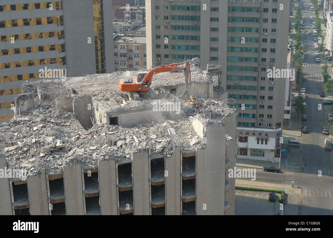 Chinese demolition workers use an unconventional method to destroy a ...