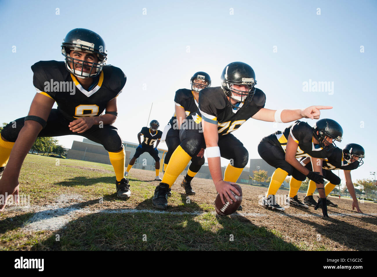 Full length squatting football hi-res stock photography and images - Alamy