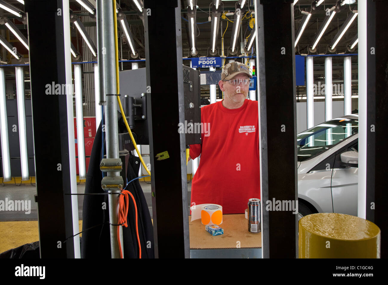 Workers assemble the 2012 Ford Focus at Ford Motor Co.'s Michigan ...