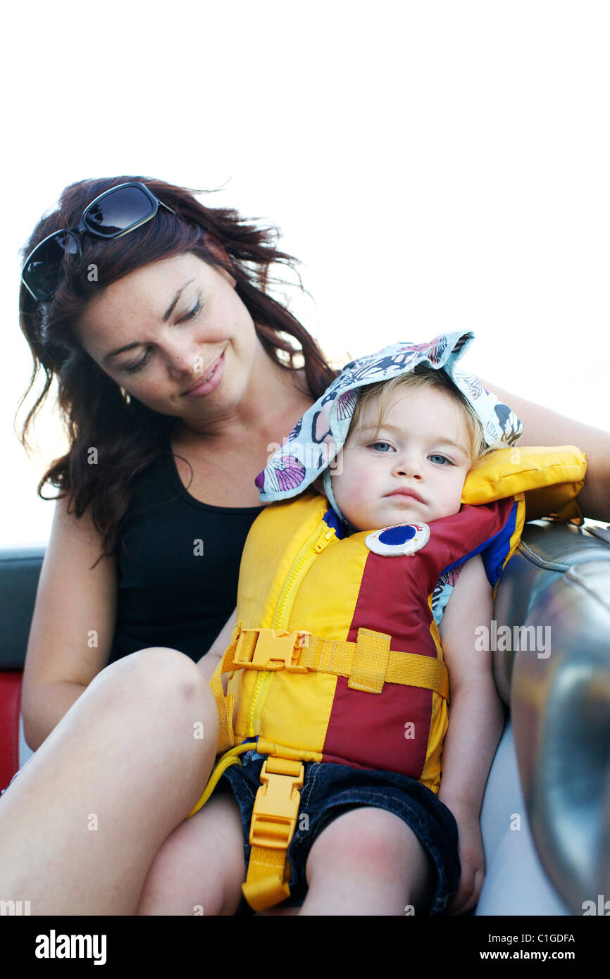 Caucasian mother looking at daughter wearing life jacket Stock Photo ...
