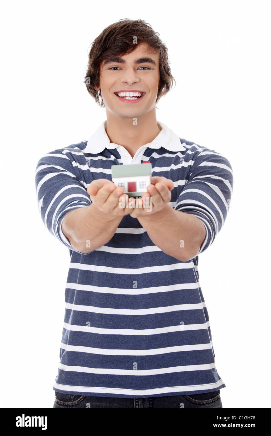 Young man with house's model. Isolated on white background Stock Photo ...