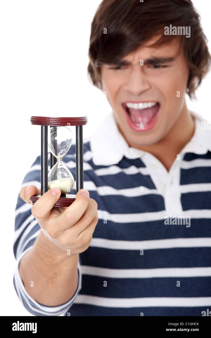 Young man with hourglass. Isolated on white background Stock Photo - Alamy
