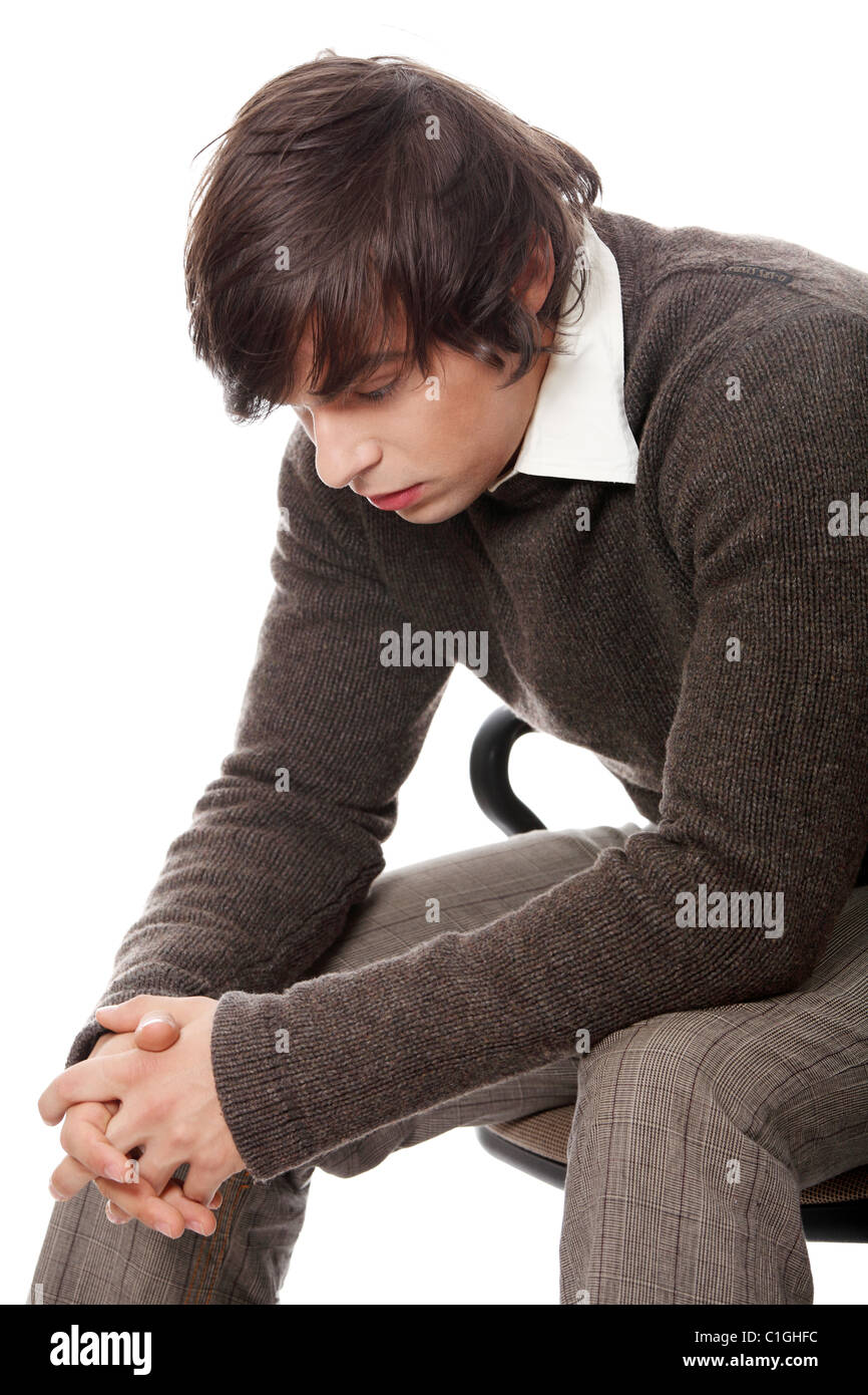 Depressed young man. Isolated on white background Stock Photo - Alamy
