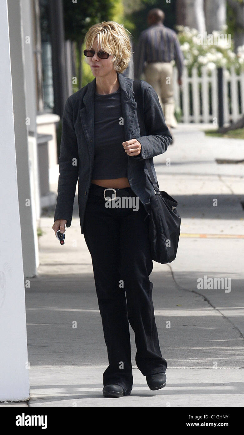 Meg Ryan dressed in black and walking in heavy boots heading for a hair ...