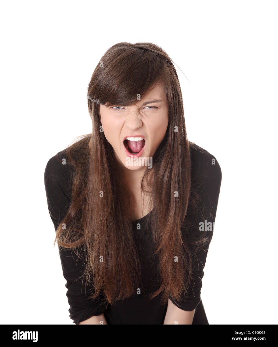 A frustrated and angry woman is screaming out loud. Isolated on white ...