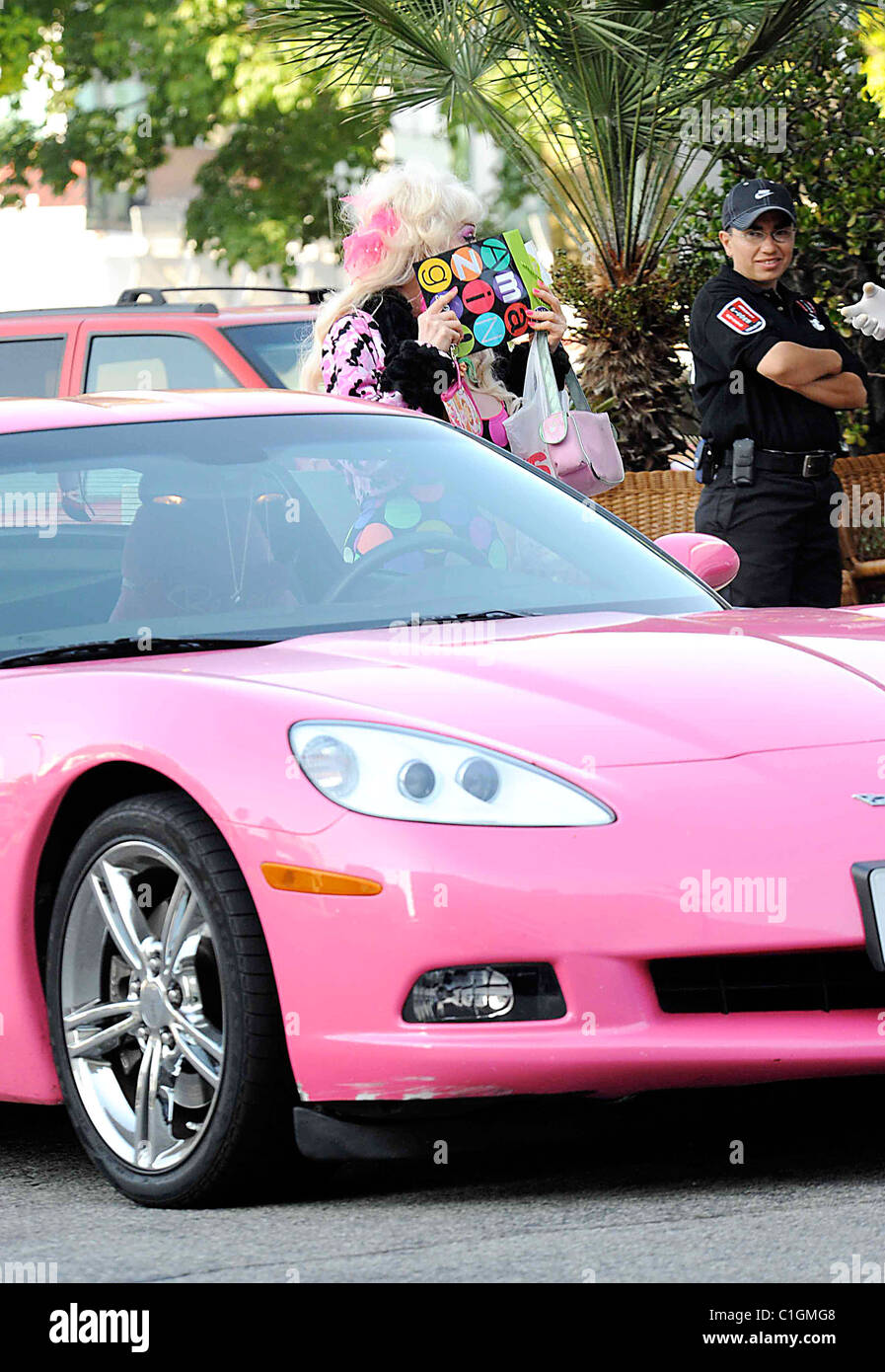 Angelyne leaves Longs Drugs in Beverly Hills in a pink Pontiac Firebird ...