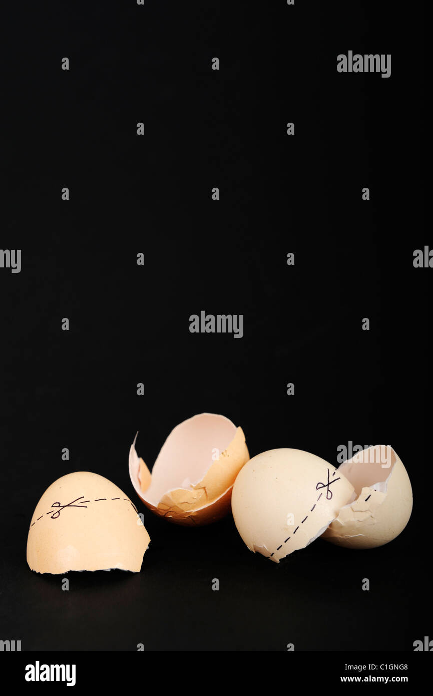 Stock photo of cracked egg shells with a cut here mark across the shell ...