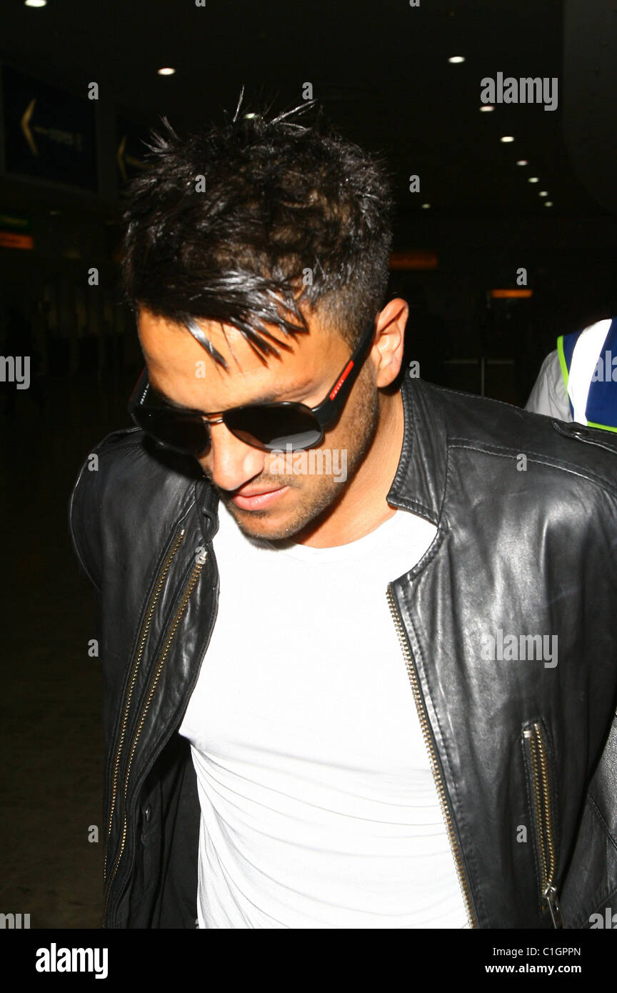 Peter Andre arrives at Heathrow Airport with his manager and brother ...