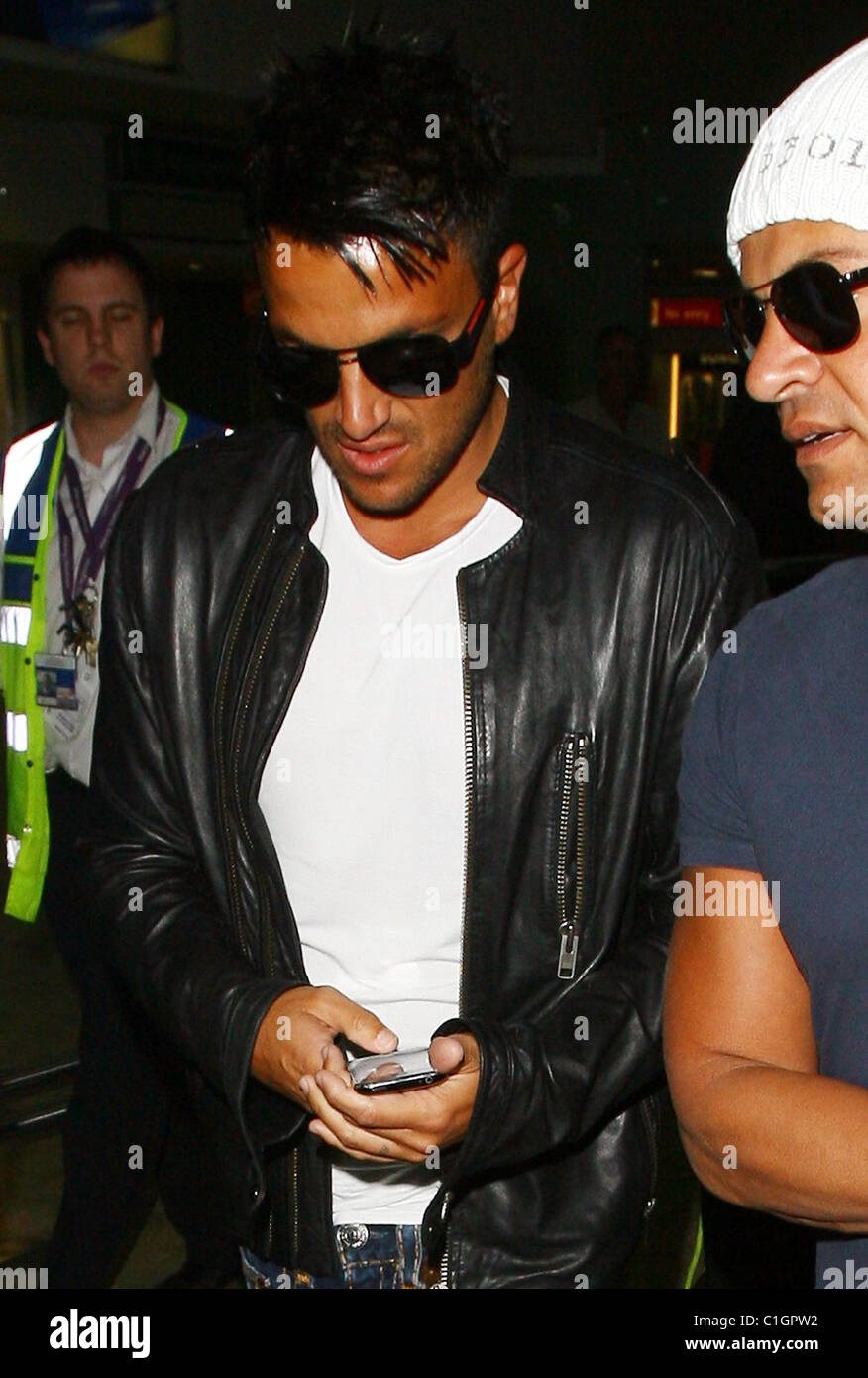 Peter Andre arrives at Heathrow Airport with his manager and brother ...