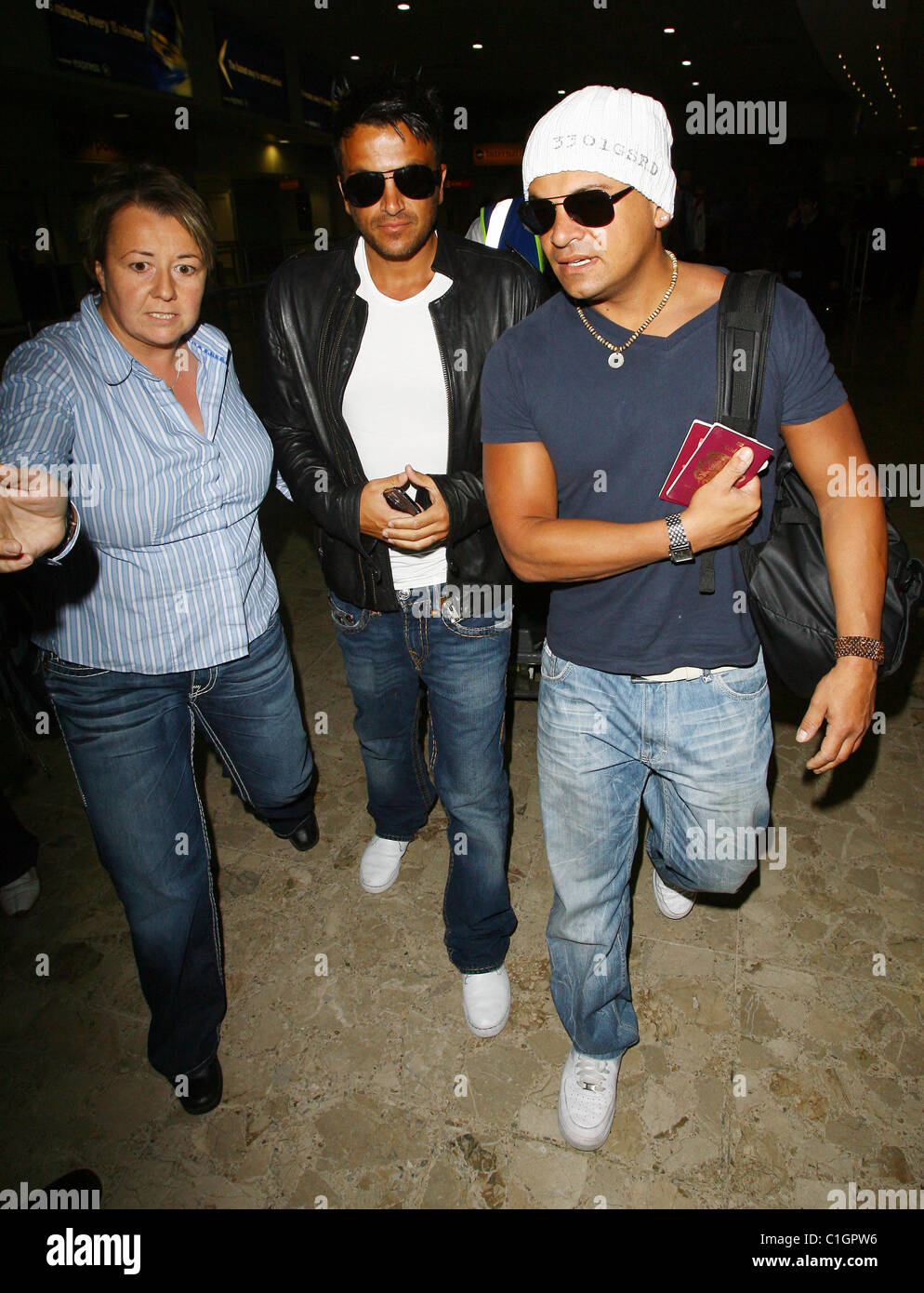 Peter Andre arrives at Heathrow Airport with his manager and brother ...
