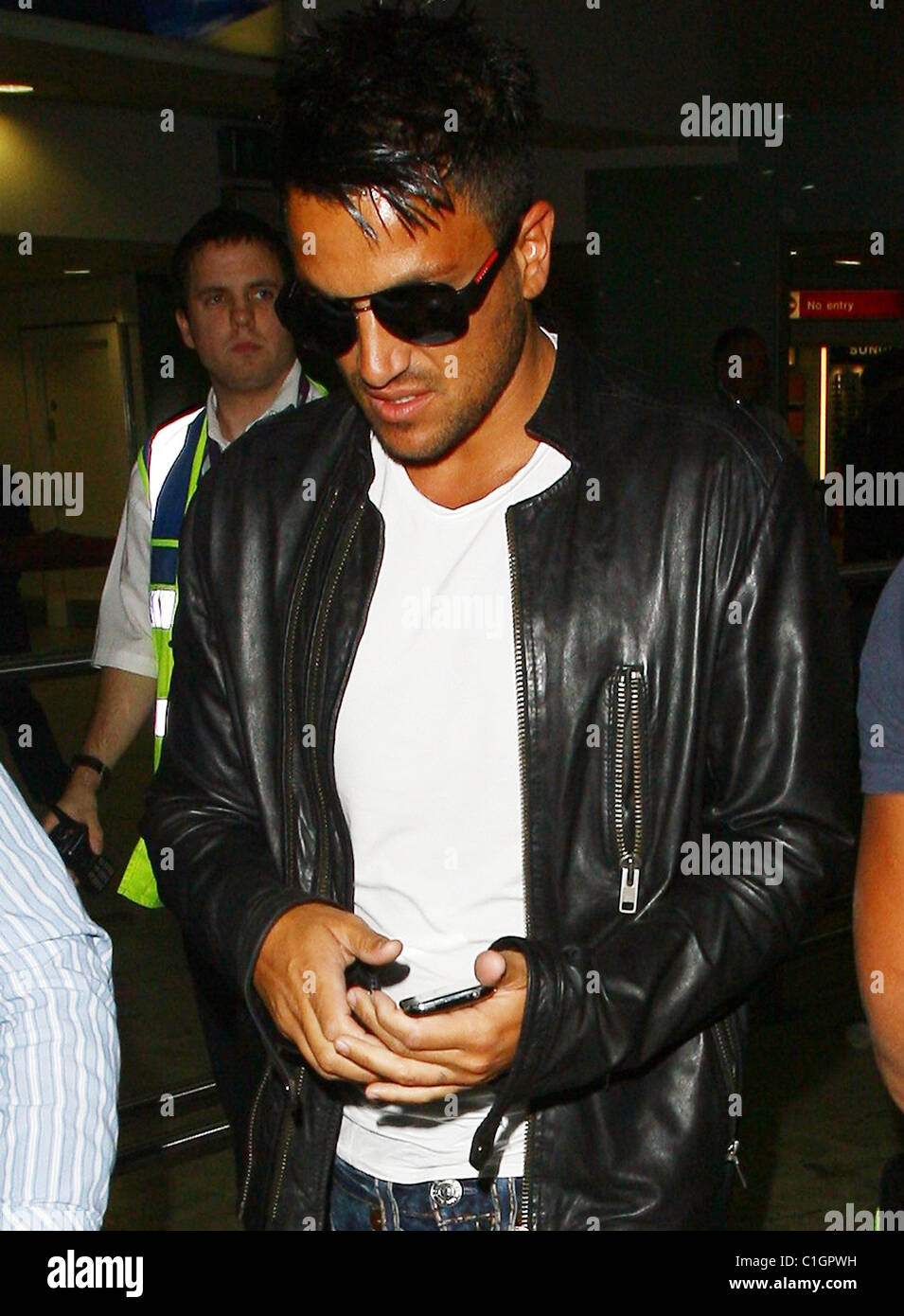 Peter Andre arrives at Heathrow Airport with his manager and brother ...