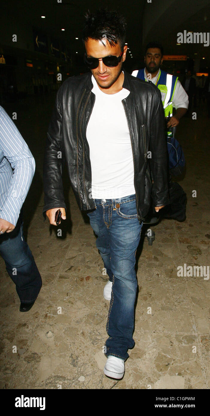 Peter Andre arrives at Heathrow Airport with his manager and brother ...