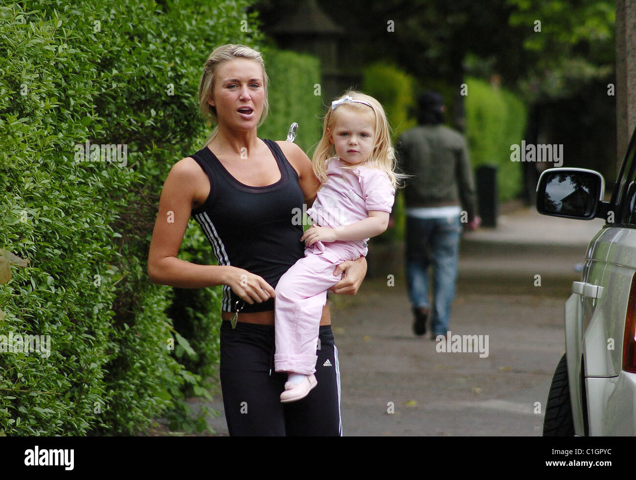 Liverpool WAG Alex Curran holding her daughter Lexie in her arms after ...