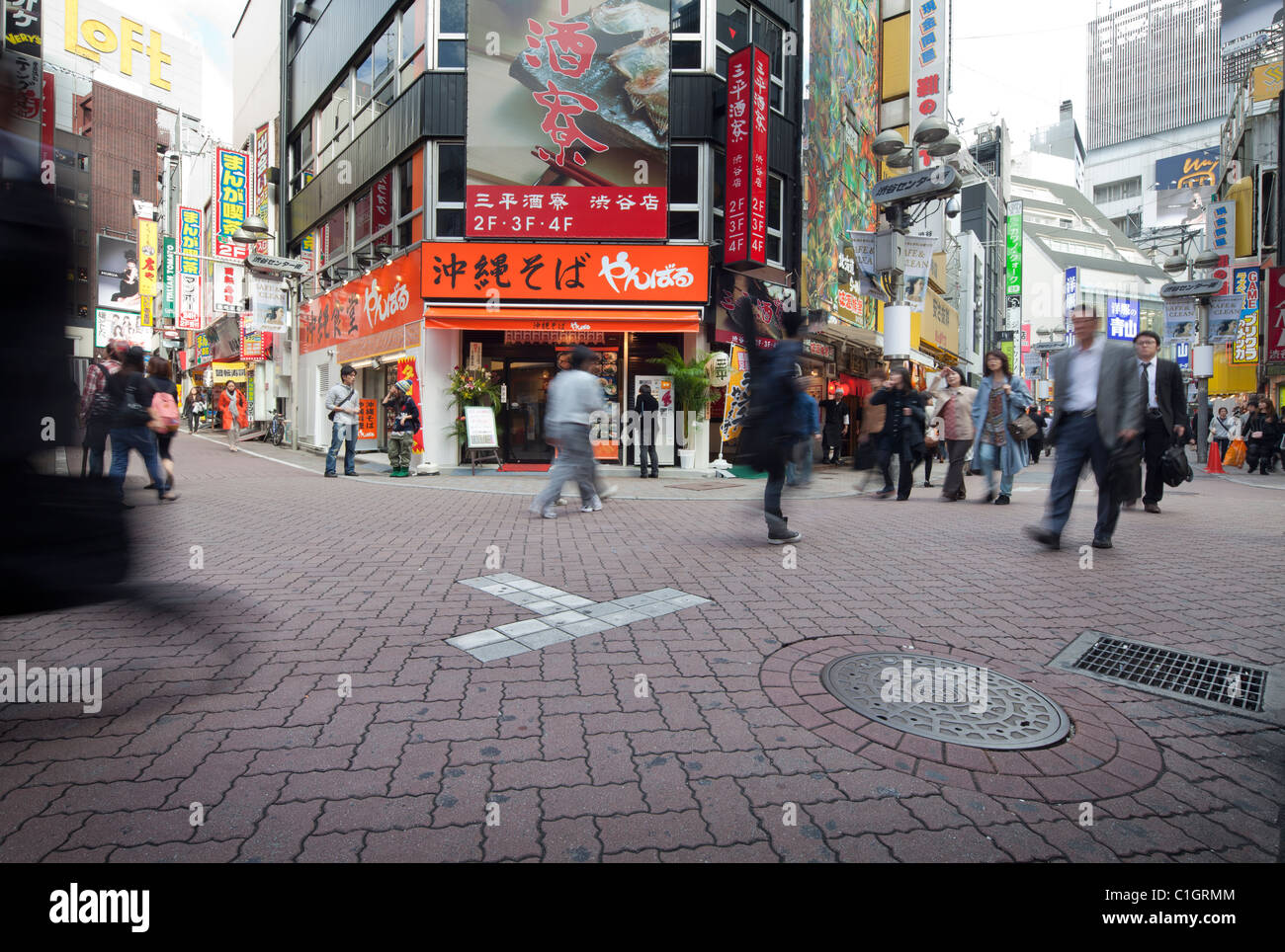 Pedestrians cross the busiest intersections in Japan, Shibuya, Tokyo ...