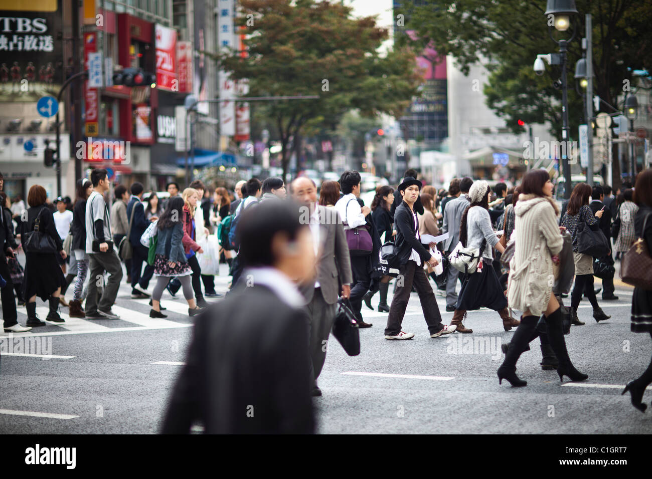 Pedestrians cross the busiest intersections in Shibuya, Tokyo, Japan ...