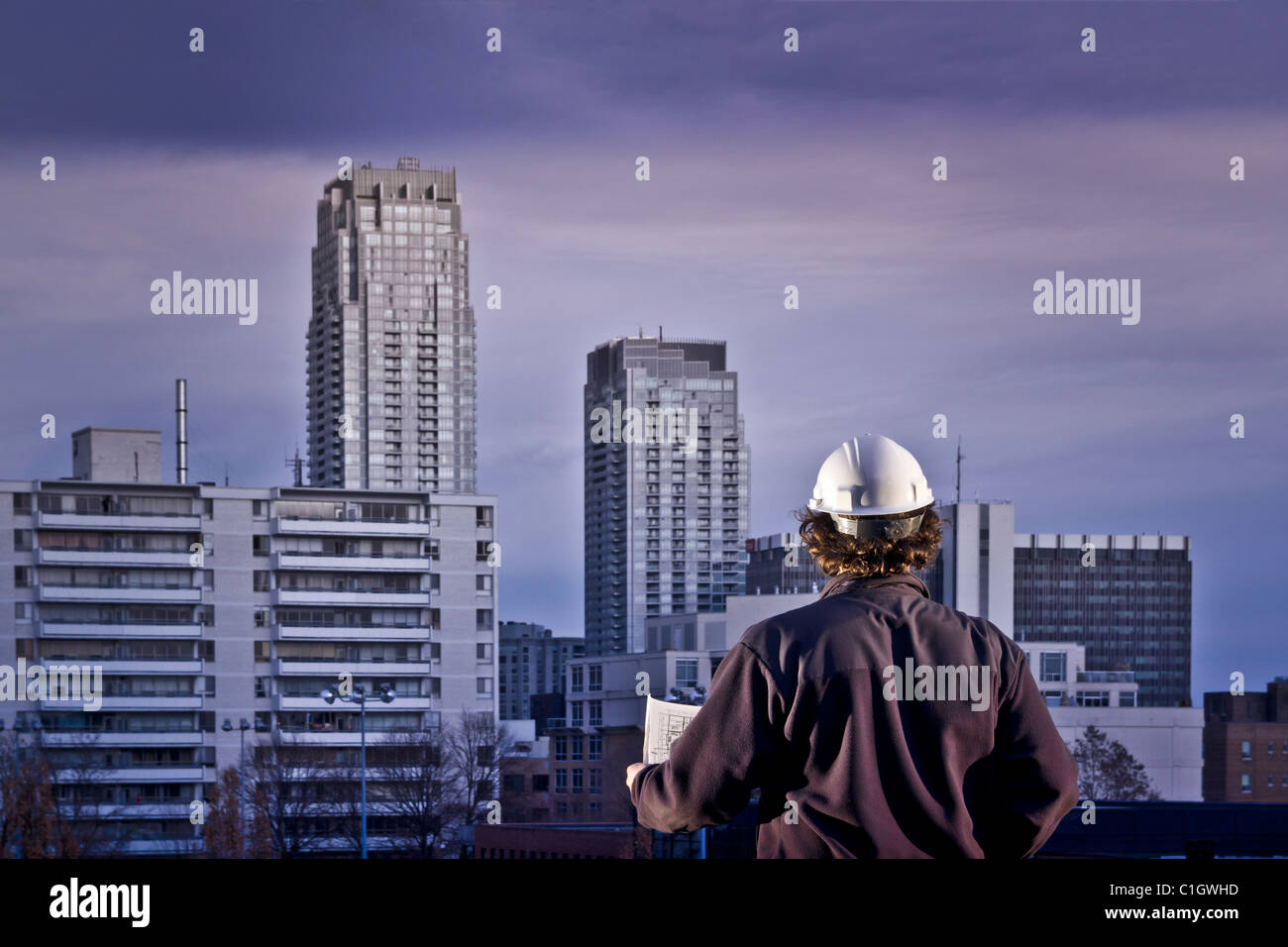 Developer surveying building construction Stock Photo - Alamy