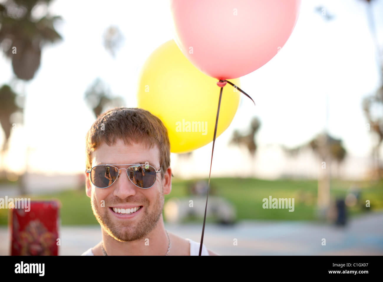 Balloons floating man hi-res stock photography and images - Alamy
