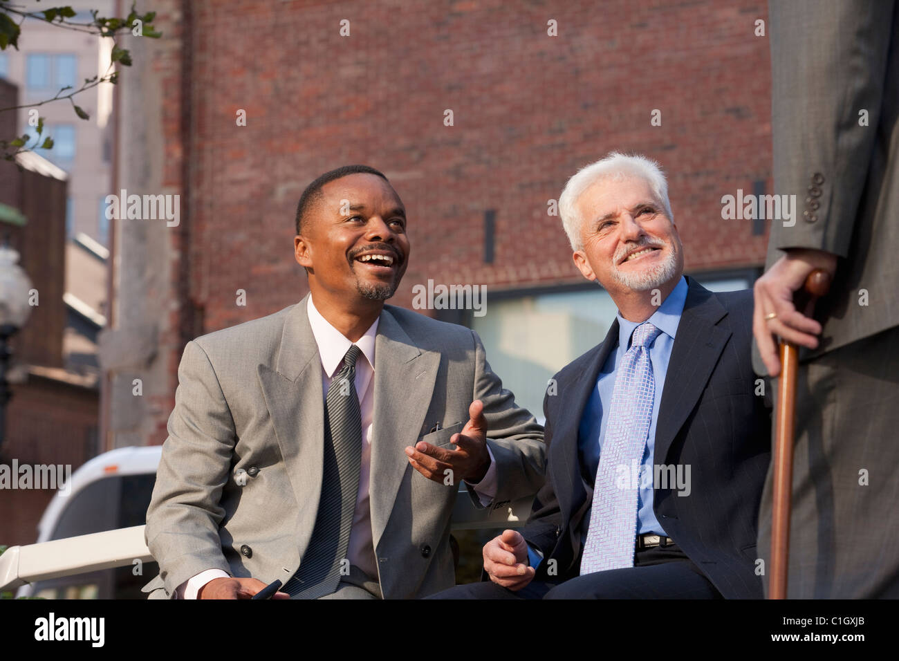 Three businessmen talking Stock Photo - Alamy