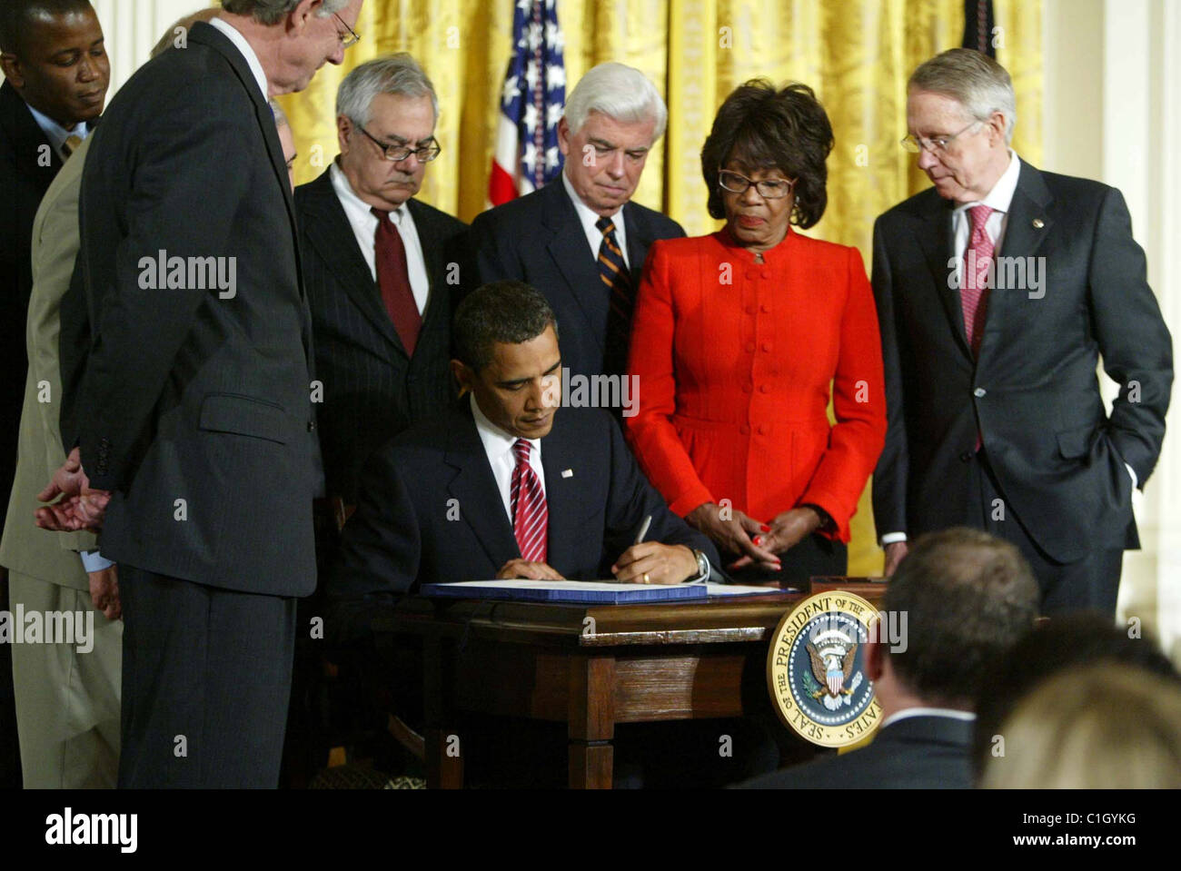 President Barack Obama signs the Helping Families Save Their Homes Act ...