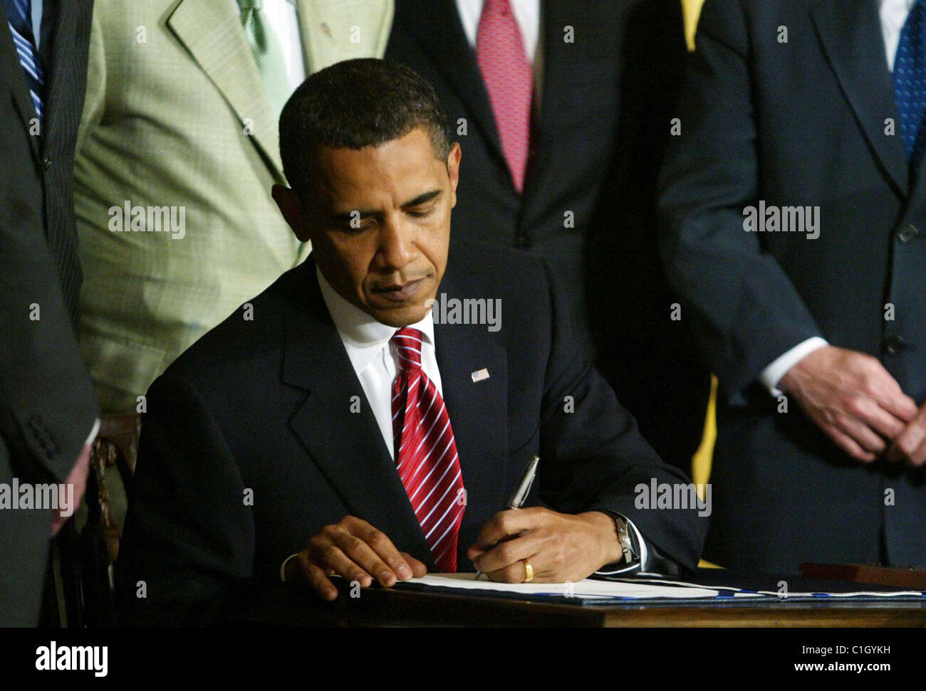 President Barack Obama signs the Helping Families Save Their Homes Act ...