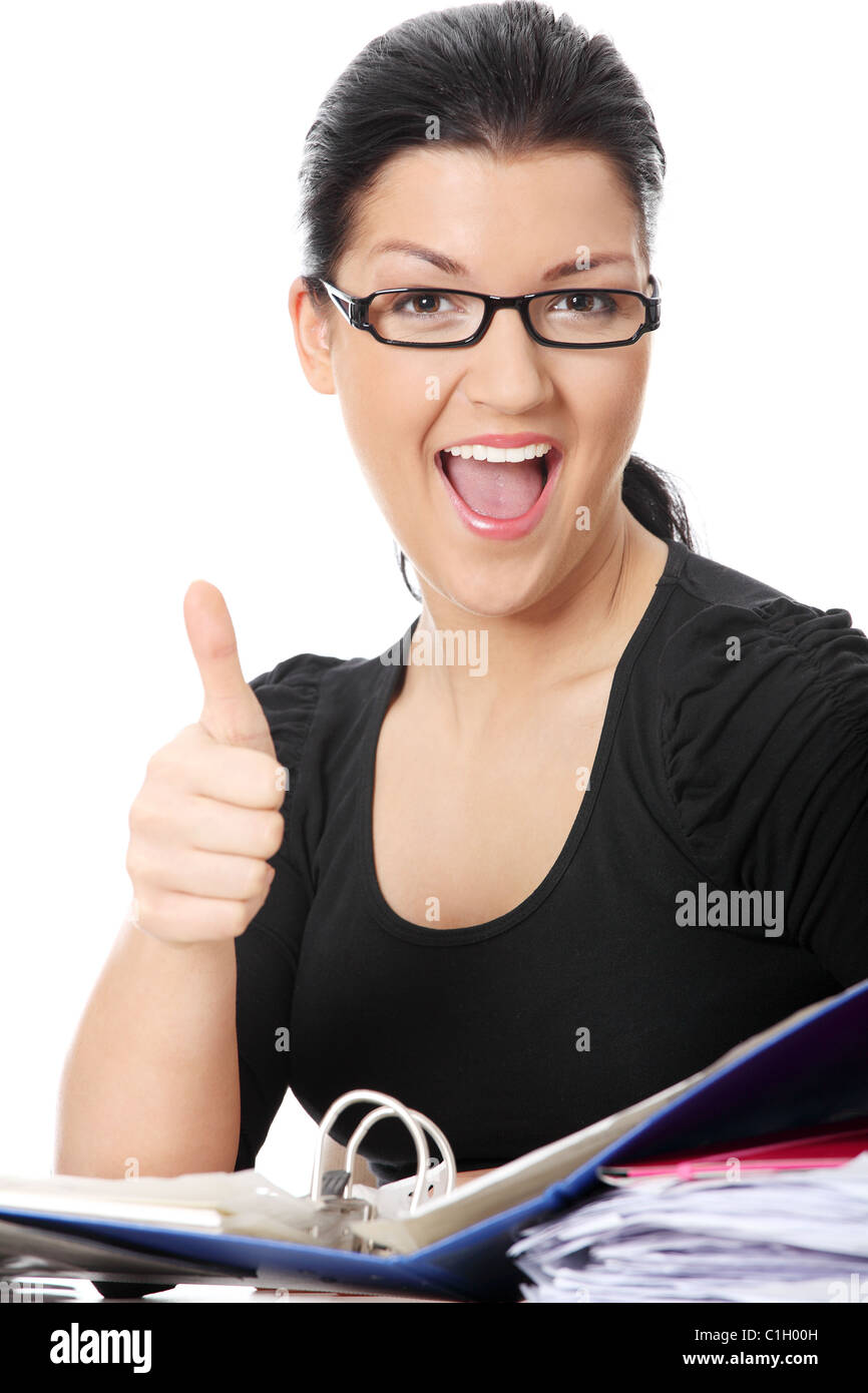 Young woman at the desk gesturing OK, isolated on white Stock Photo - Alamy