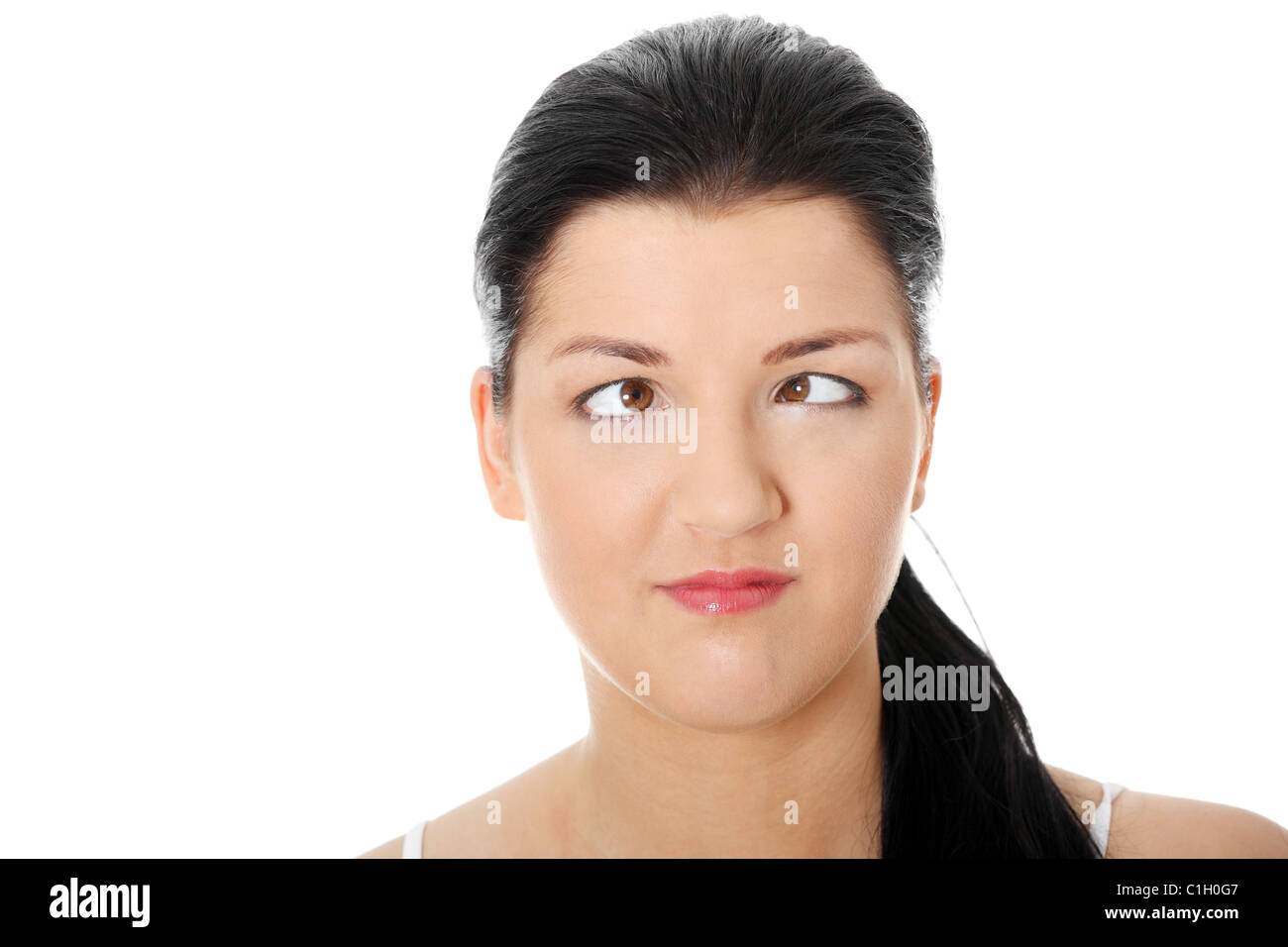 Young woman making squint, isolated on white Stock Photo - Alamy