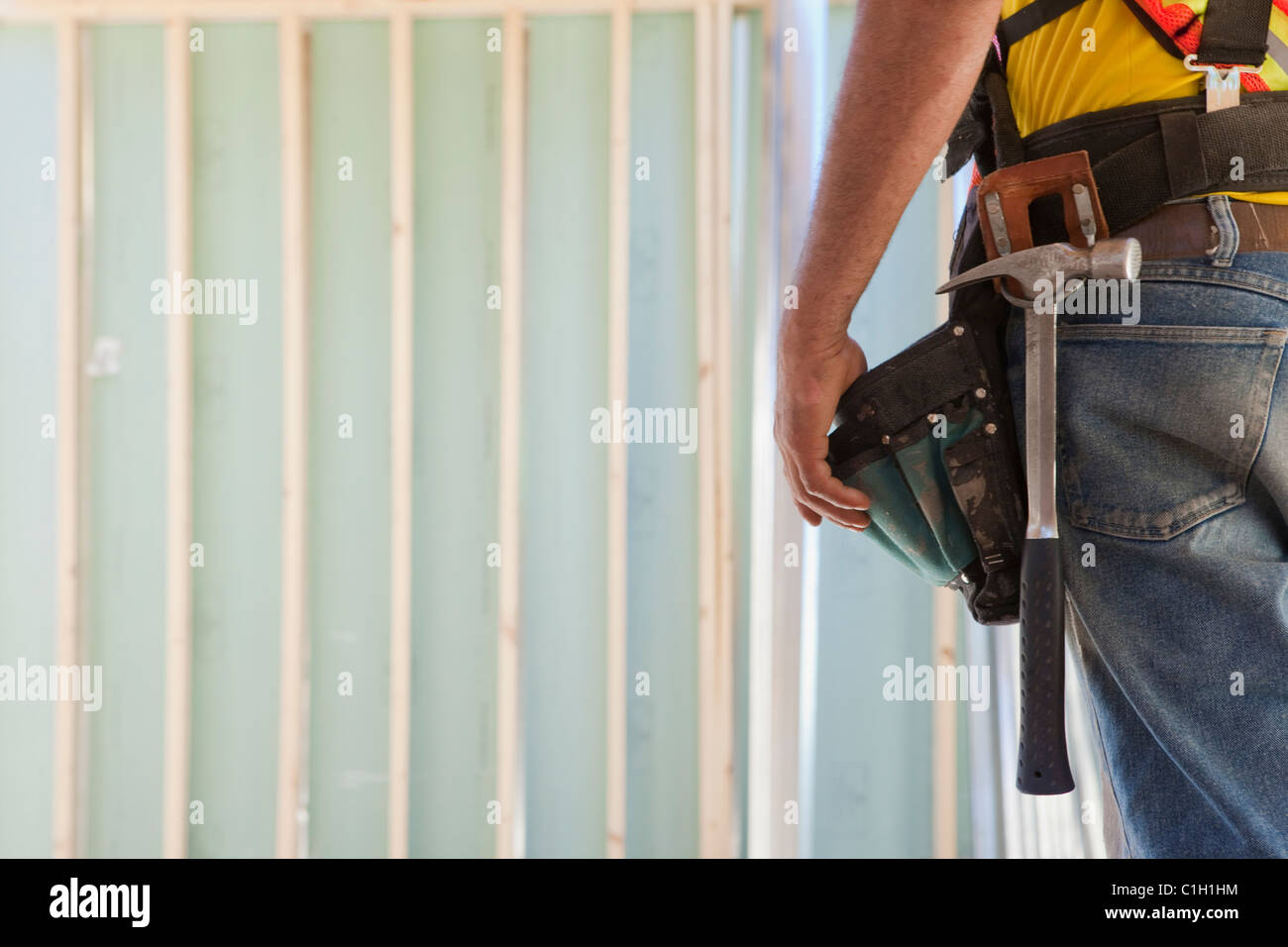 Mid section view of a carpenter wearing a tool belt Stock Photo - Alamy
