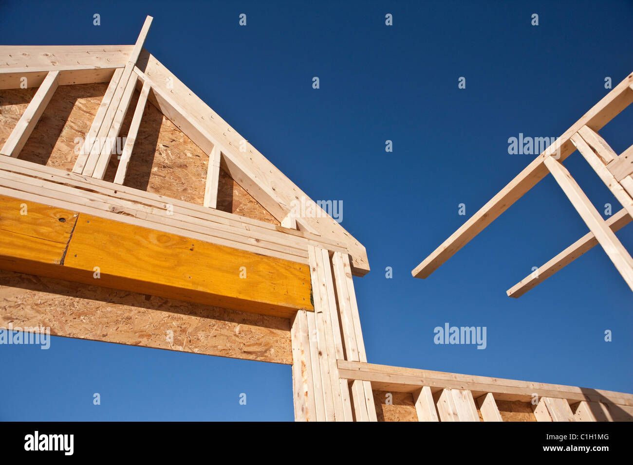 Upper story framing for a house under construction Stock Photo - Alamy