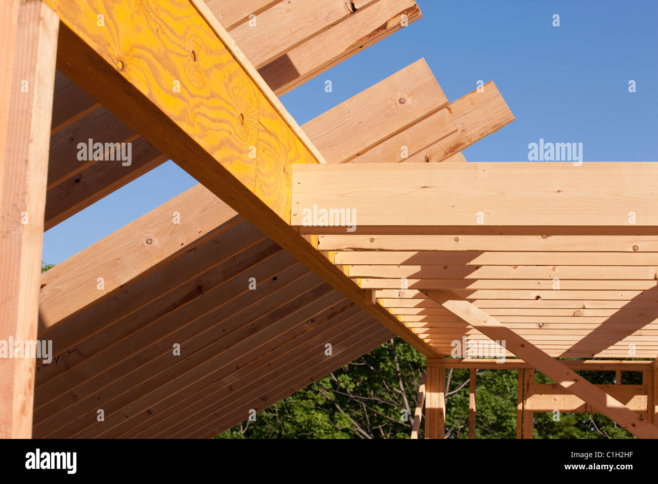 Low angle view of roof rafters with beams and joists Stock Photo - Alamy