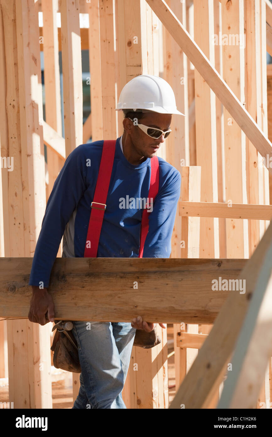 Carpenter carrying wooden beam hi-res stock photography and images - Alamy