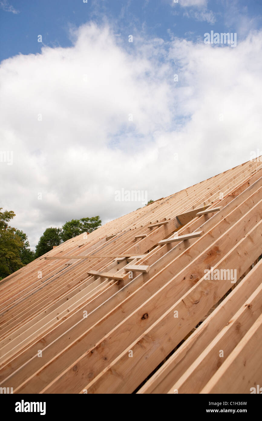 Roof rafters of a house under construction Stock Photo - Alamy