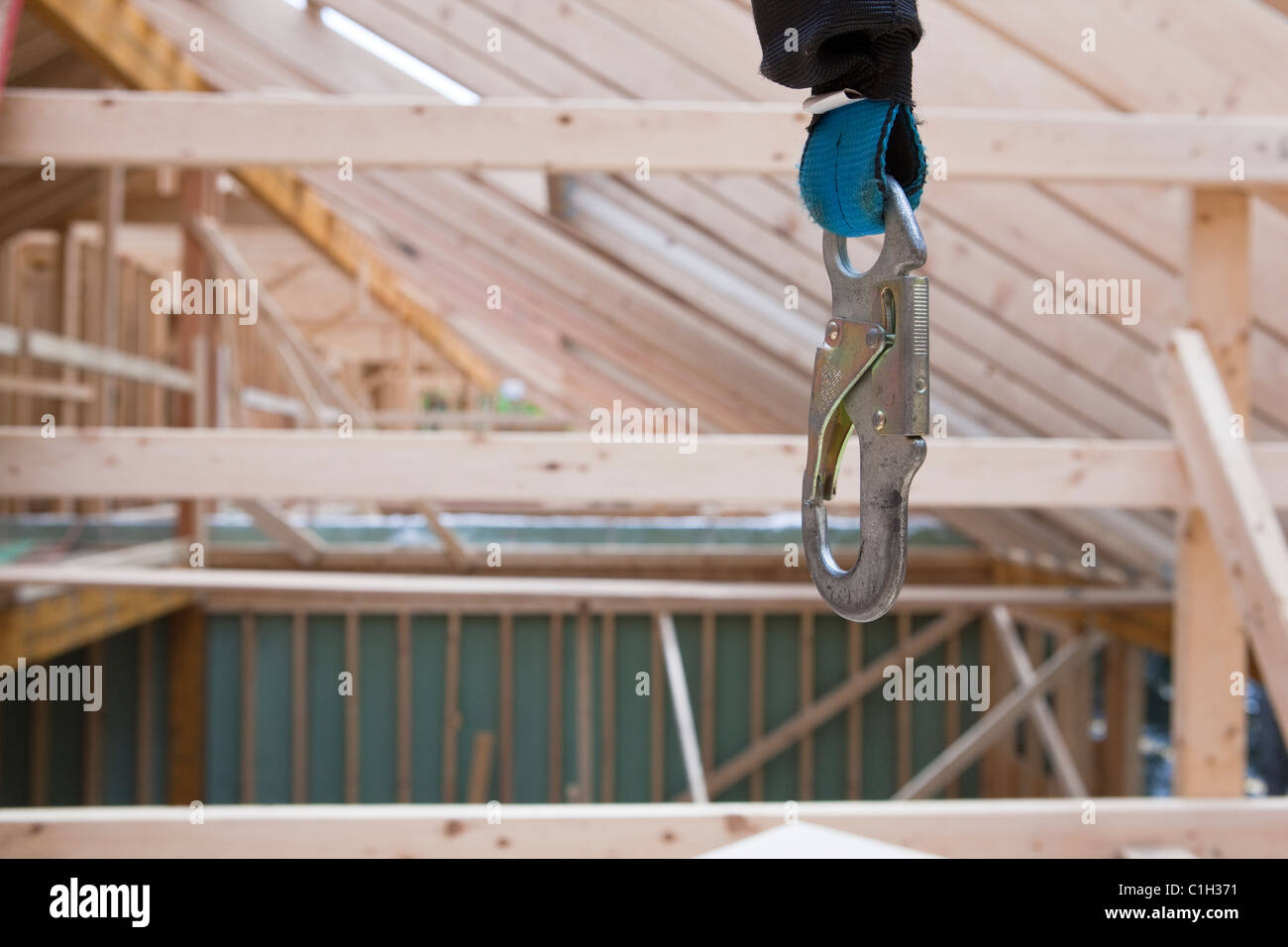 Safety harness hanging at a house under construction Stock Photo - Alamy