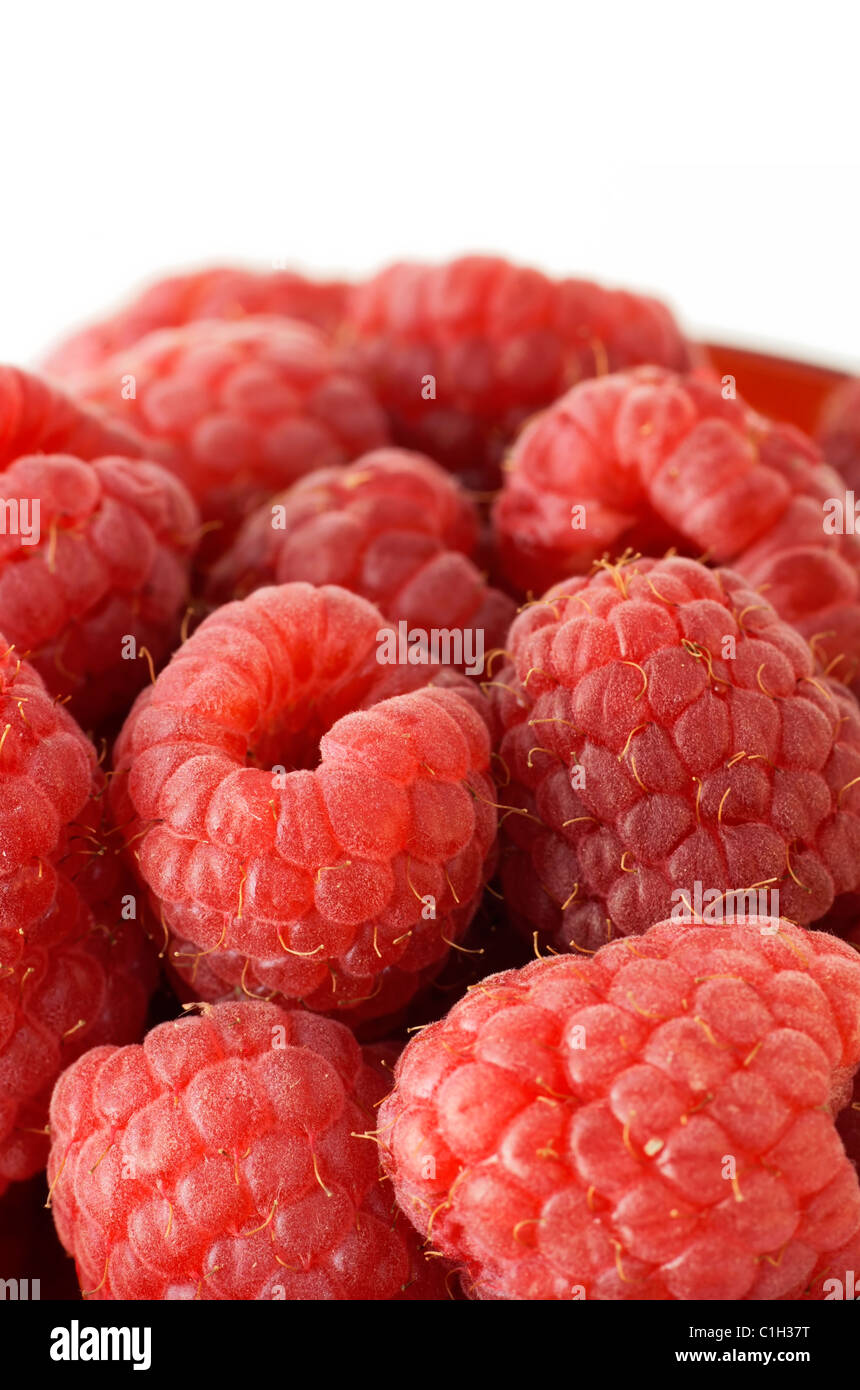 Vertical of fresh and healthy ripe red raspberries, perfect snack and ...